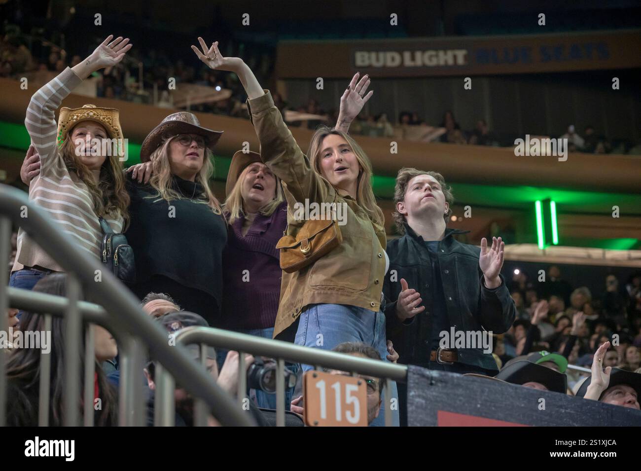 Spectators sing along during the second round of the Professional Bull ...