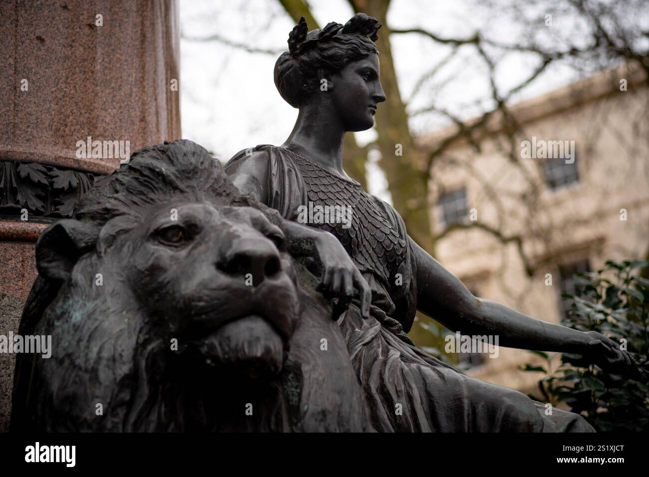 Life-size allegorical statue of Britannia lounging on a reclining lion ...