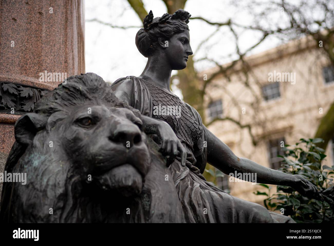 Life-size allegorical statue of Britannia lounging on a reclining lion ...