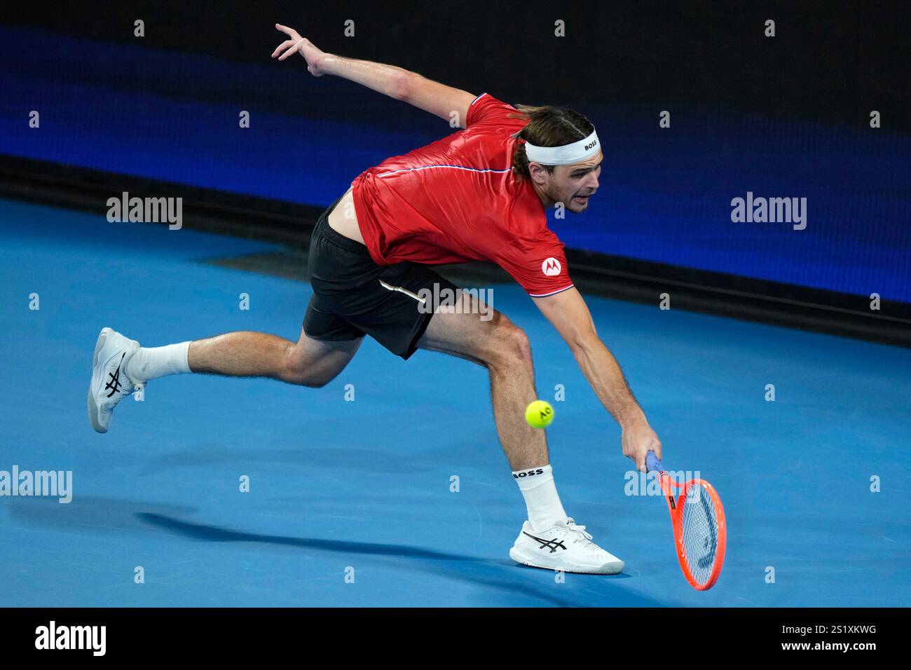 Taylor Fritz of the U.S. hits a backhand to Poland's Hubert Hurkacz ...