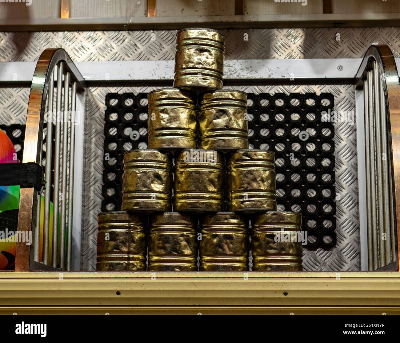 10 cans are stacked to throw a ball at at the funfair Stock Photo - Alamy