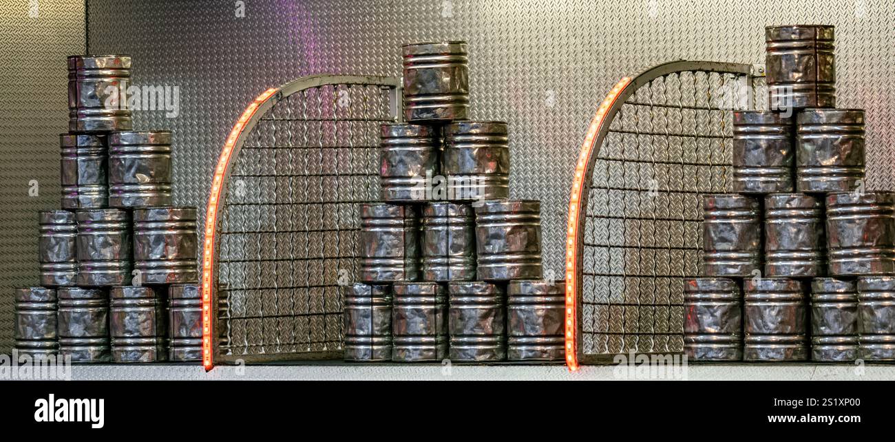 10 cans are stacked to throw a ball at at the funfair Stock Photo - Alamy