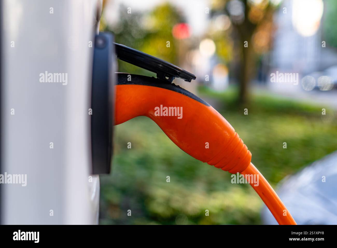 loading electrically powered car outdoors Stock Photo - Alamy