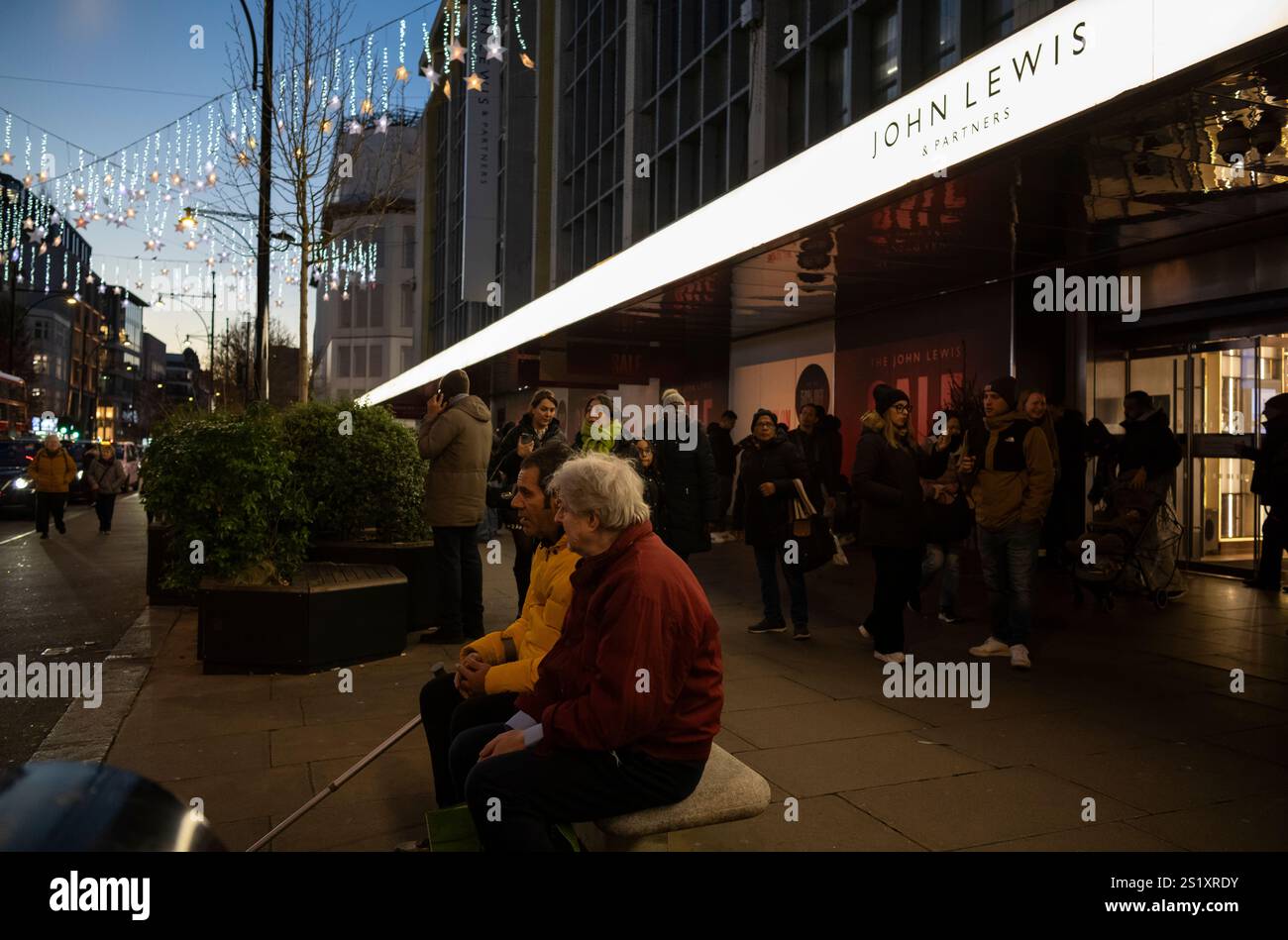 Busy evening activity along Oxford Street outside John Lewis department ...
