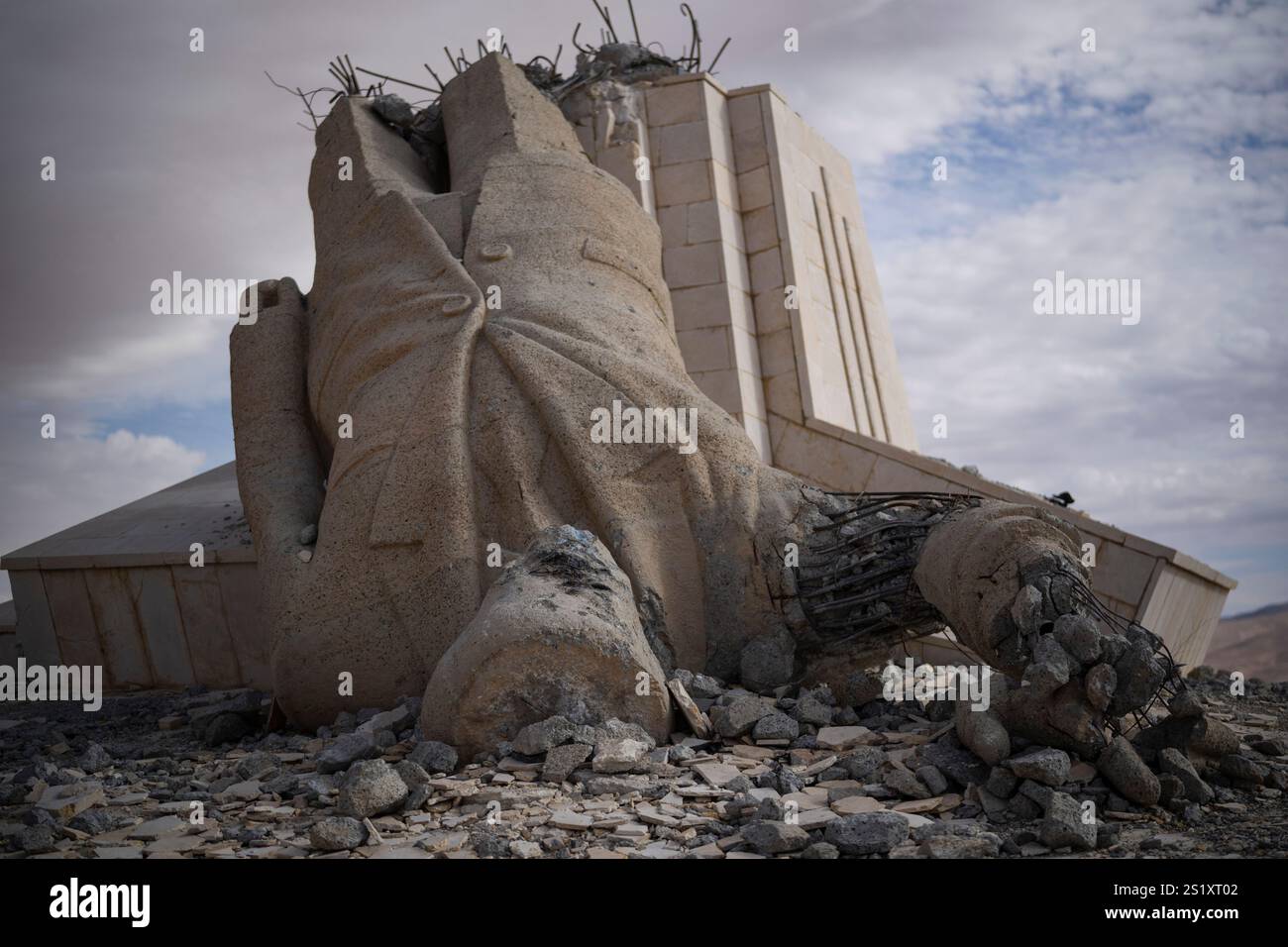 A statue depicting the late Syrian President Hafez Assad is seen ...