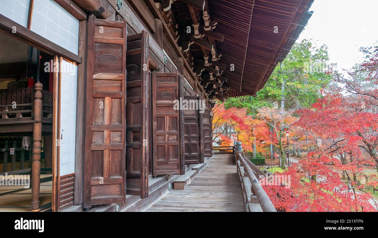 A view of the main hall at Shinnyo-do Temple with wooden doors ...