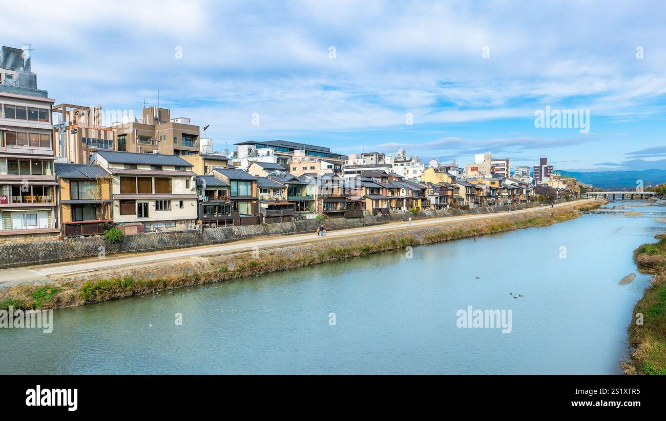 Traditional Japanese houses line the banks of the Kamo River in Kyoto ...