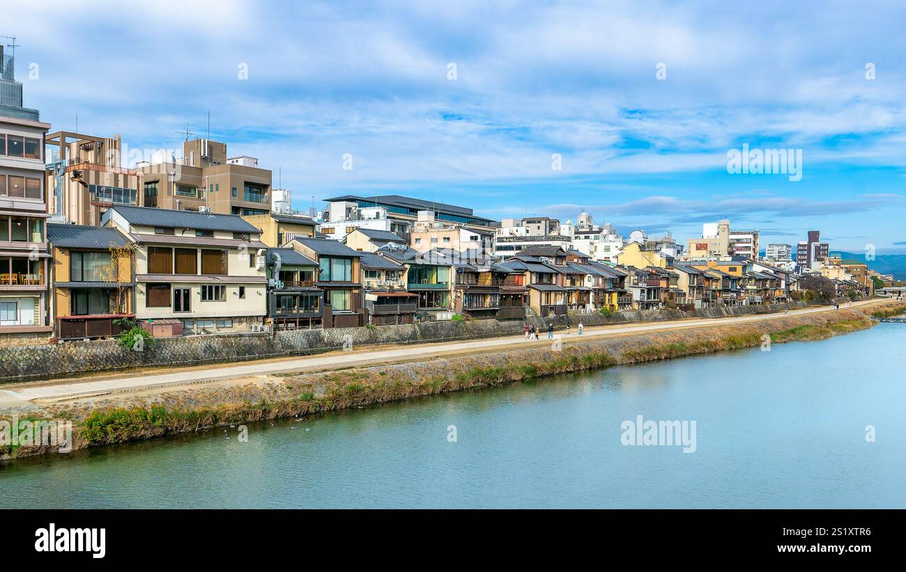 Traditional Japanese houses line the banks of the Kamo River in Kyoto ...