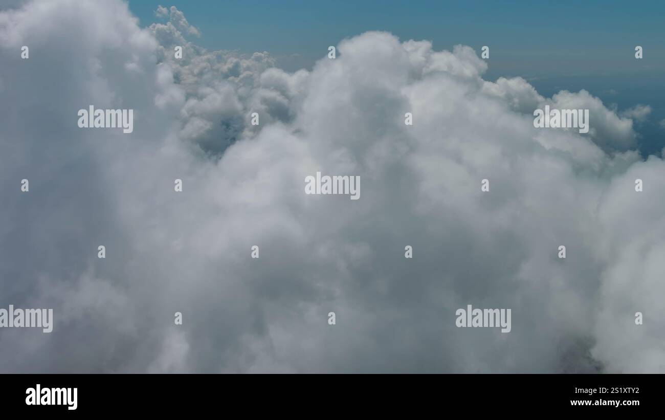 Flying through white clouds over sea Stock Photo - Alamy