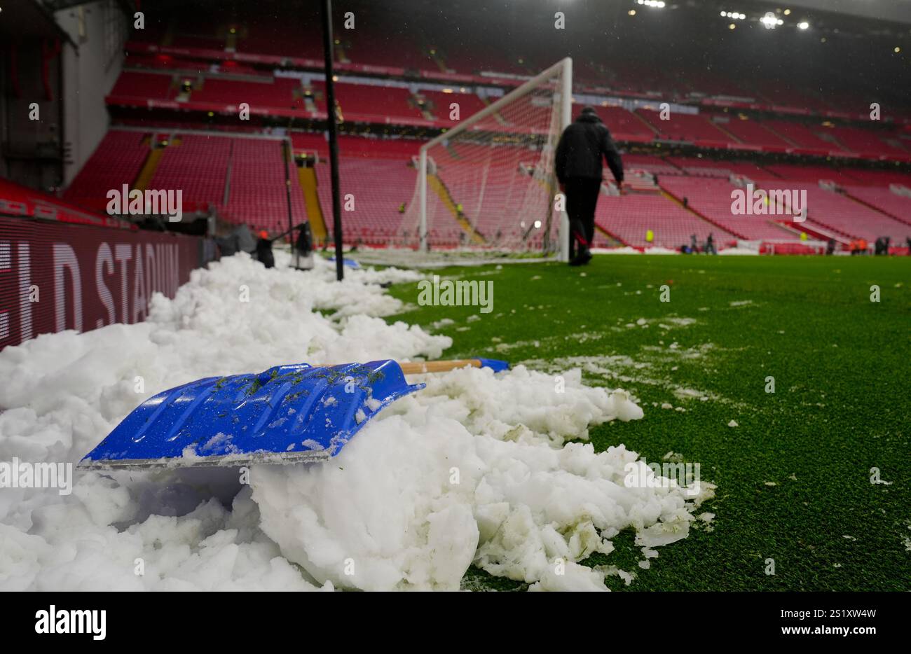 Snow and a shovel by the side of the pitch ahead of the Premier League ...