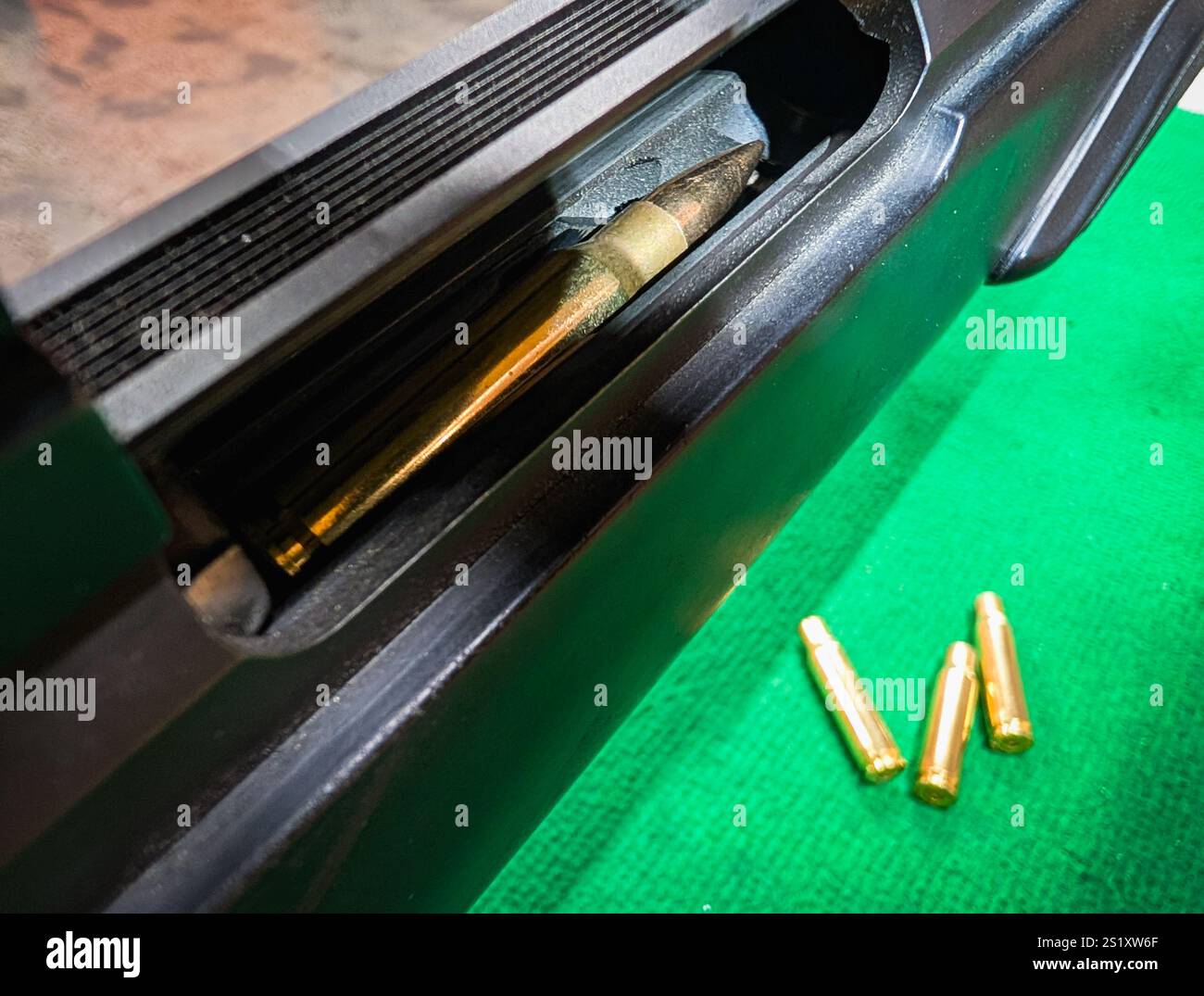 A close-up photo of a 7.62x51 caliber cartridge in a bolt-action rifle ...