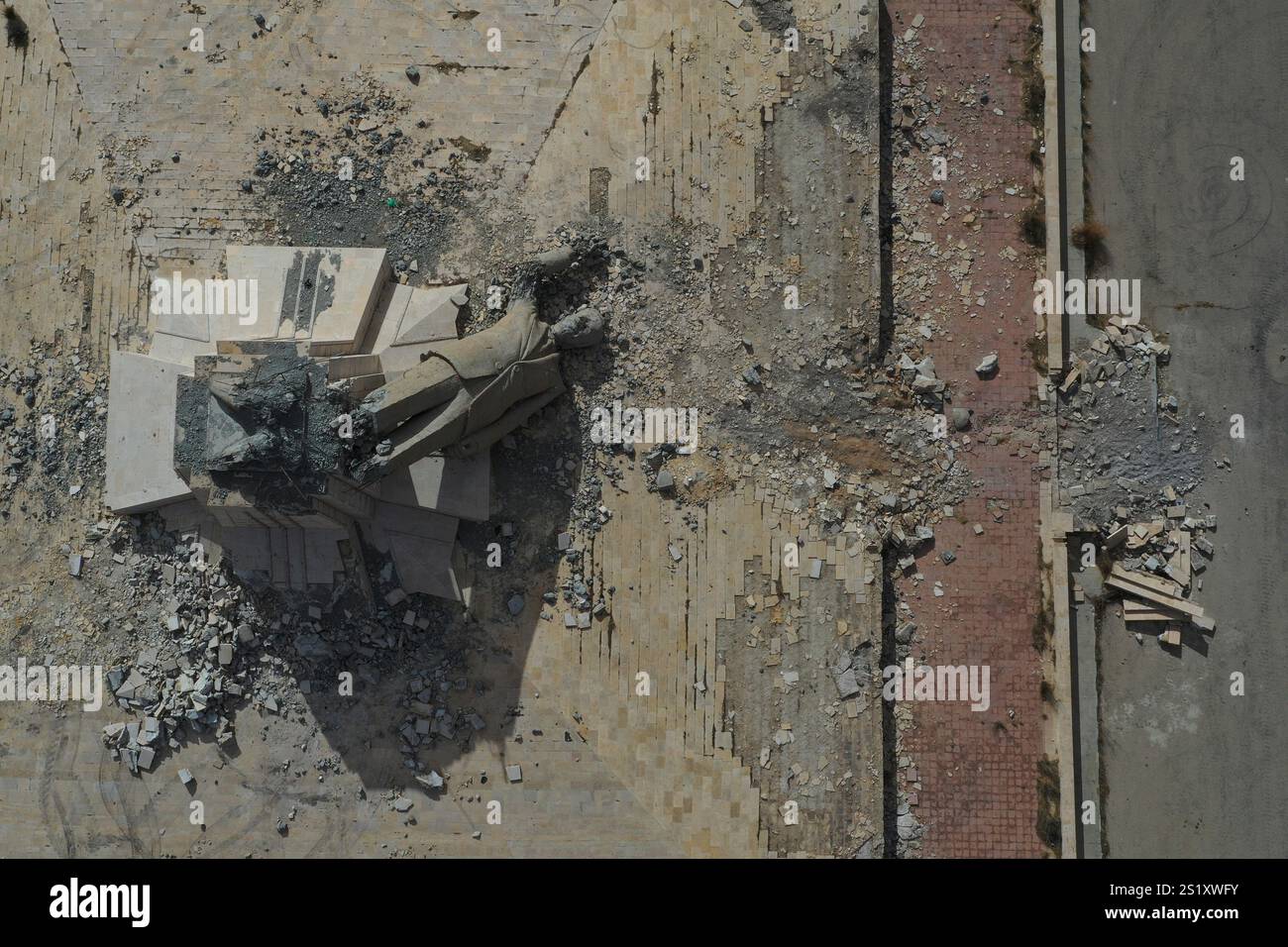 A statue depicting the late Syrian President Hafez Assad is seen ...