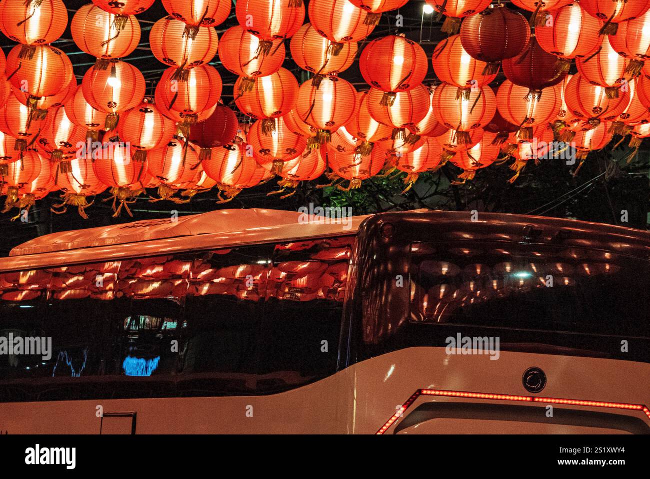 Glowing red lanterns illuminating the streets of Bangkok’s Chinatown during Chinese New Year ...