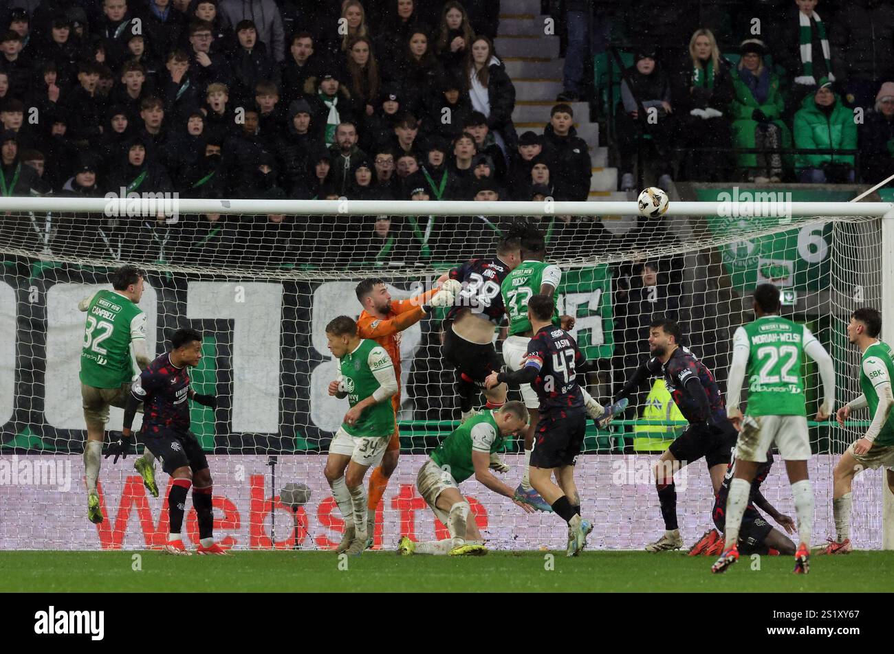 Hibernian's Rocky Bushiri scores their side's third goal of the game ...