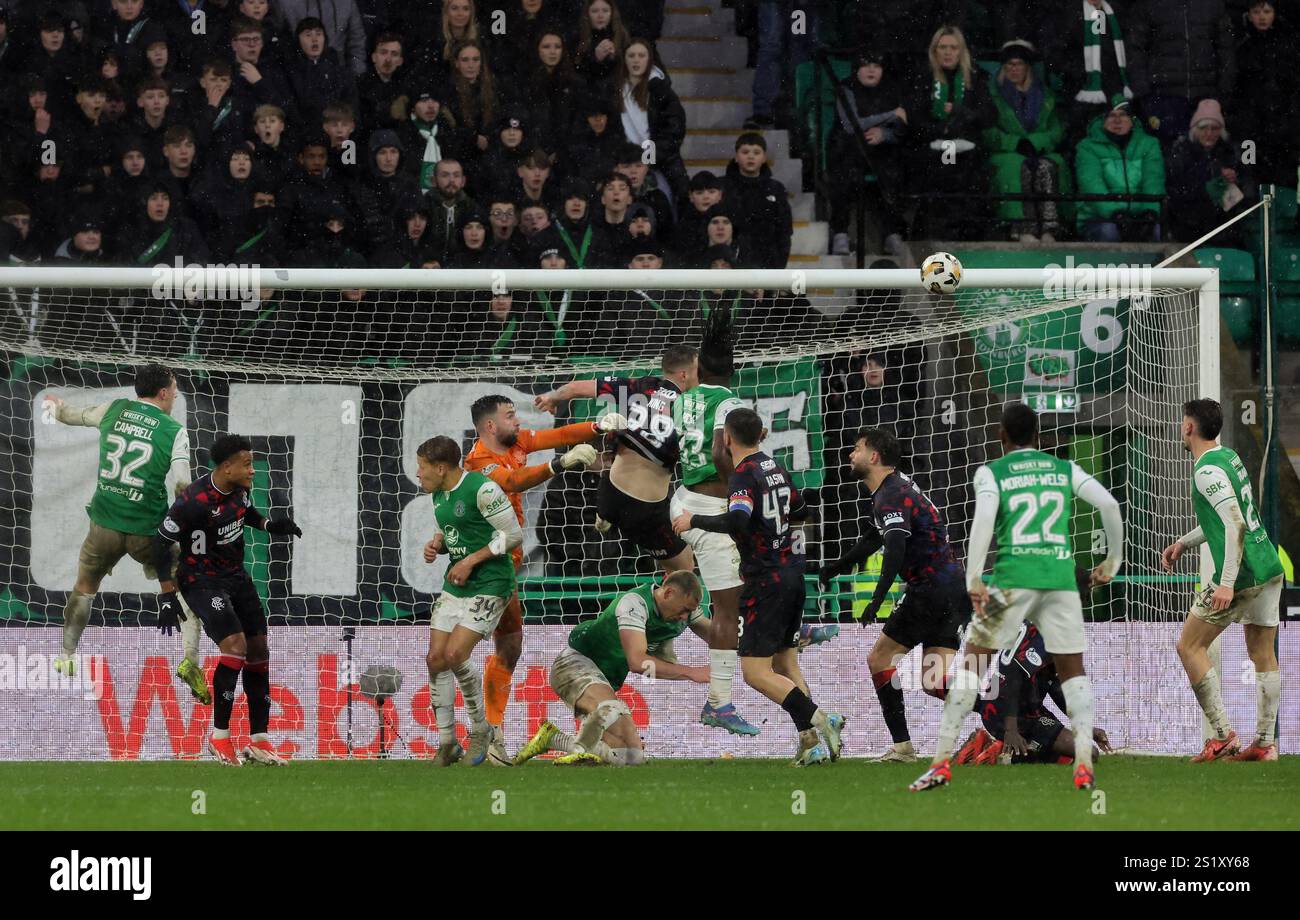Hibernian's Rocky Bushiri scores their side's third goal of the game ...