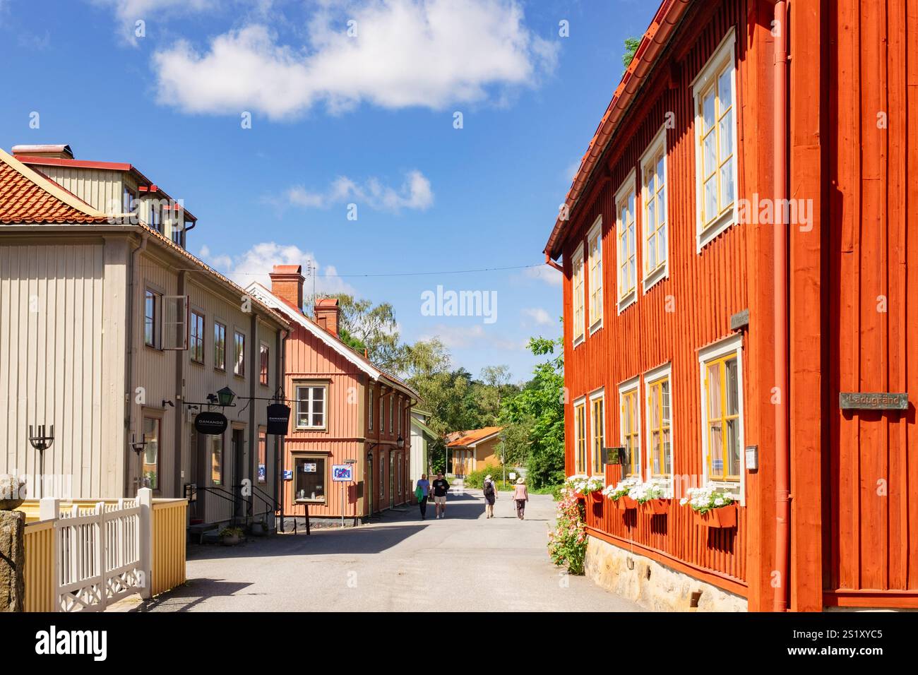 Narrow pedestrian street with wooden buildings. Stora Gatan, Sigtuna ...