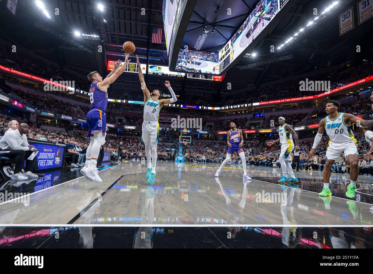 Phoenix Suns guard Grayson Allen (8) shoots over the defense of Indiana ...