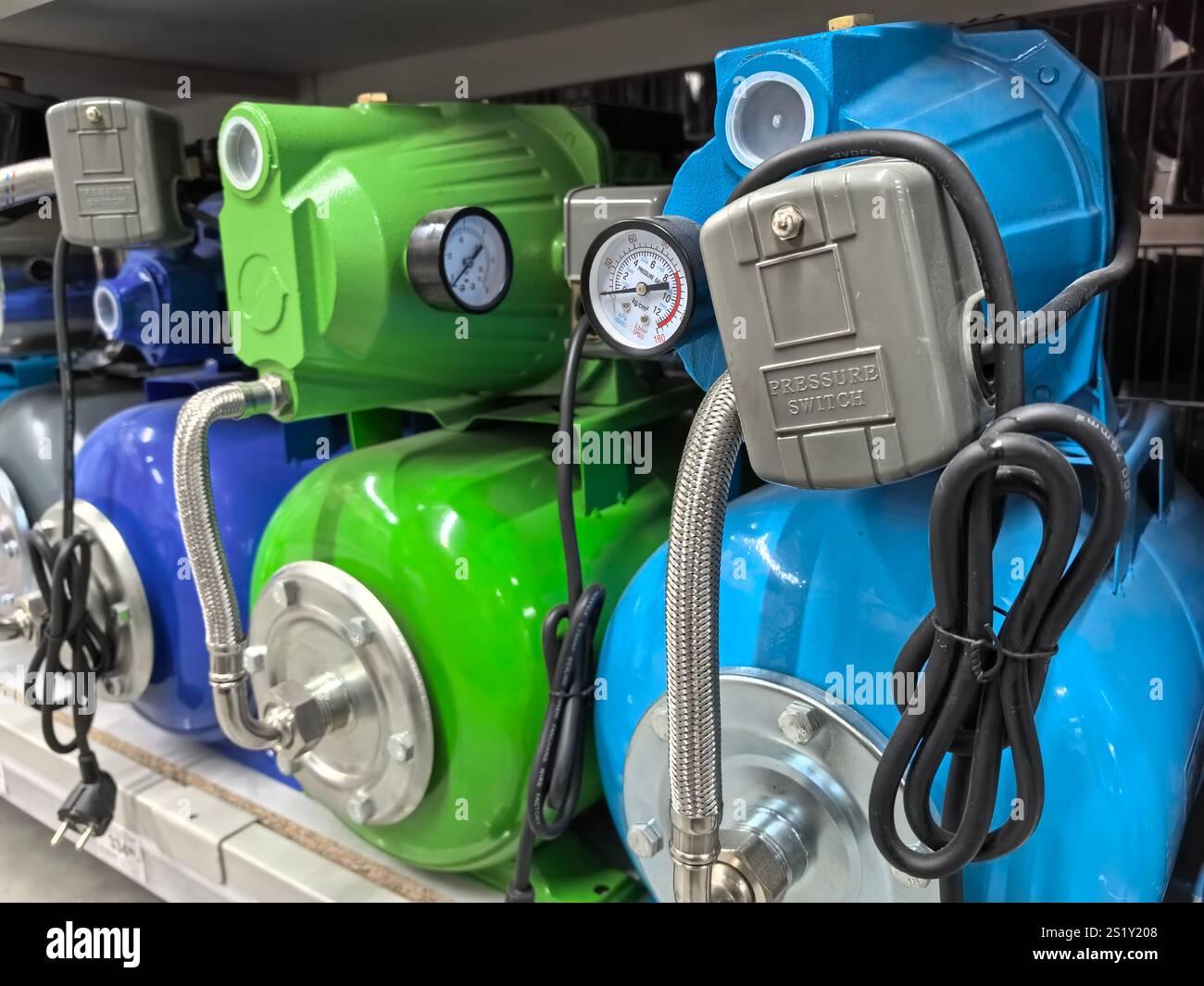 A vibrant collection of water pumps in various colors fills the display ...