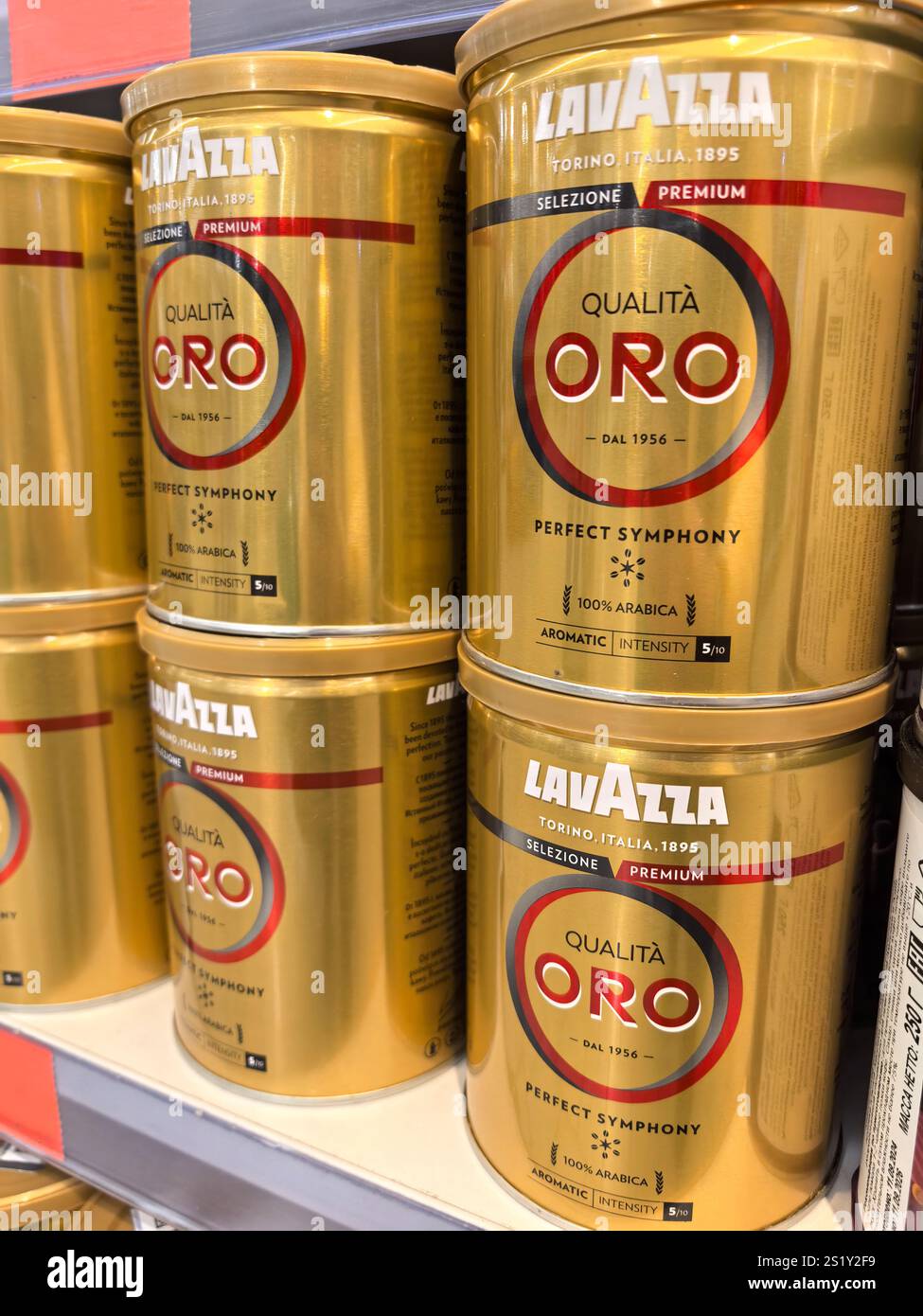 Bobruisk, Belarus - December 30, 2024: Rows of shining gold coffee cans ...
