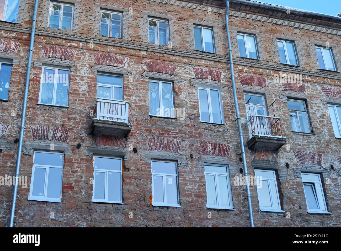 A Beautiful Historic Brick Building Featuring Balconies and Sleek ...