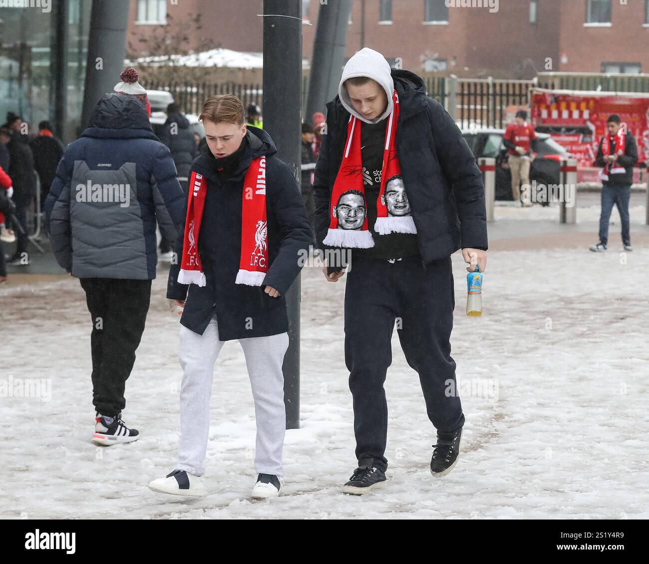 Fans make their way to Anfield in adverse snow and ice conditions ...