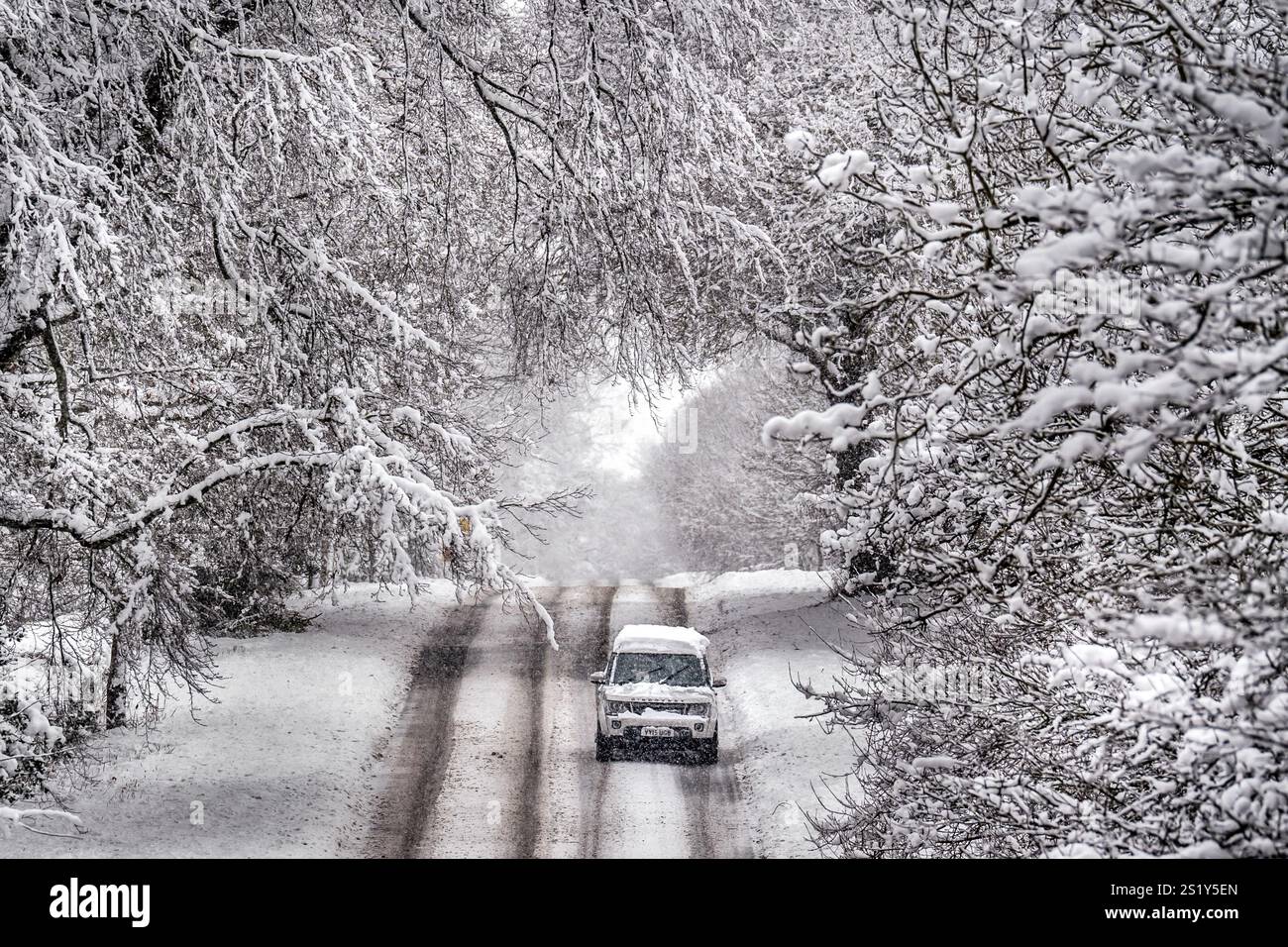 A vehicle is driven along a snow covered road in Scotton, Harrogate ...