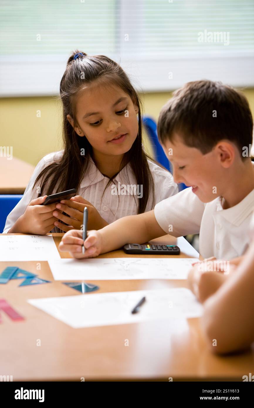 Junior School: Collaborative Learning. A candid classroom scene with ...