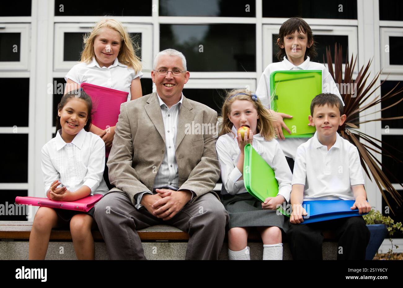 Junior School: Candid Class Portrait. A small group of junior age children with their teacher ...