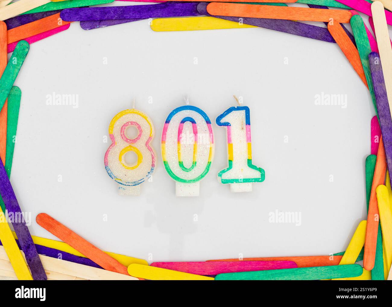 Candles in shape of the number 801 in popsicle colorful sticks frame ...