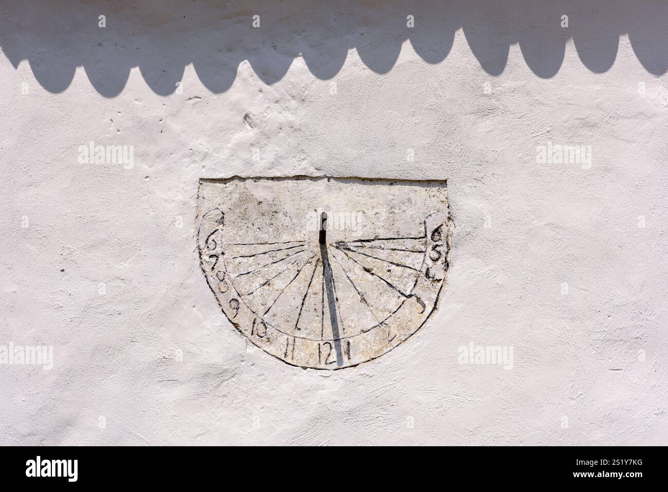 Ancient solar clock on the wall of a rural church in Romania. Ancient ...