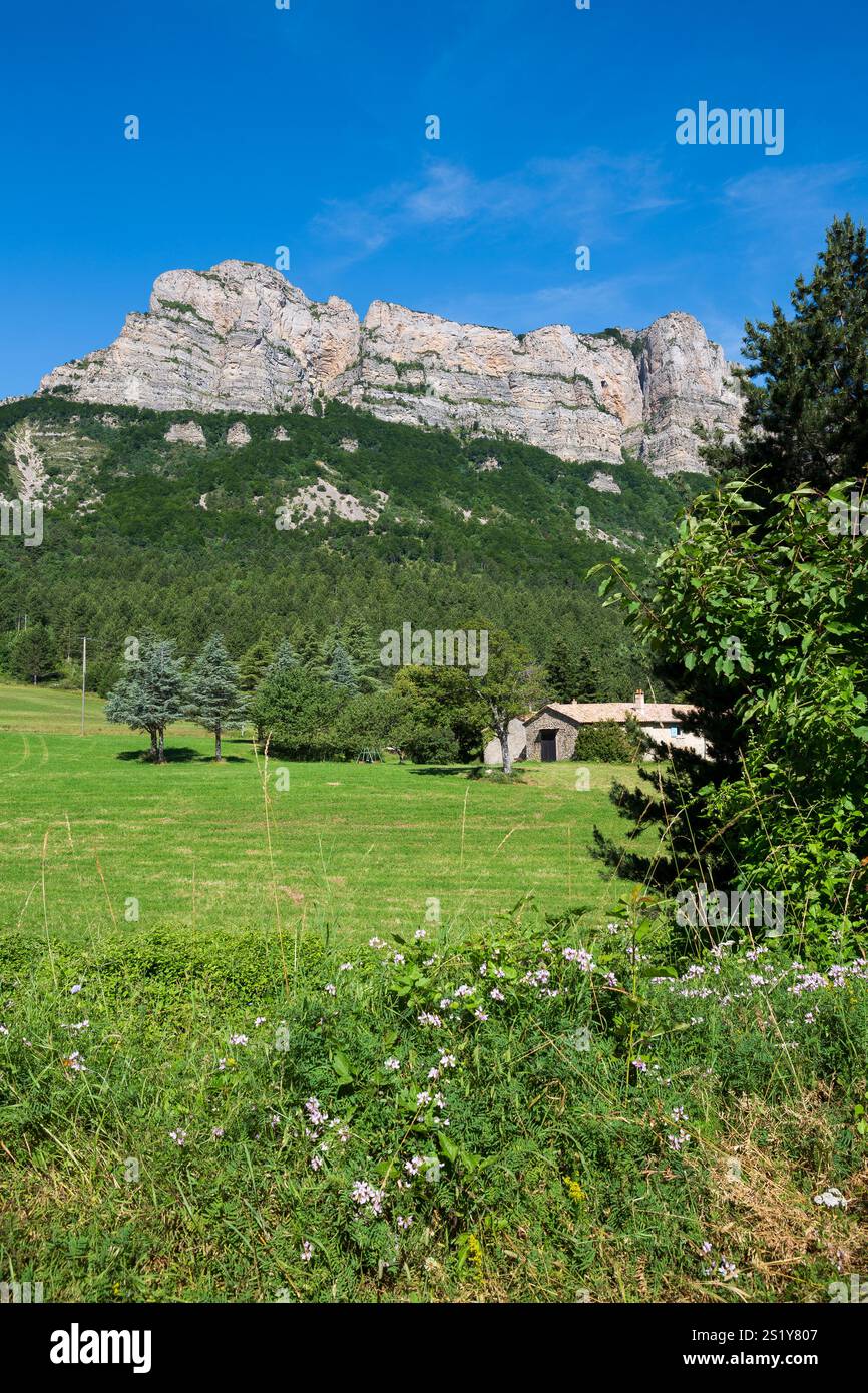 The limestone cliffs of Les Trois Becs form a dramatic backdrop to a ...