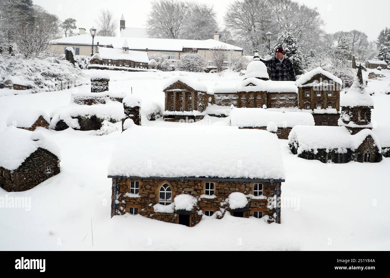Lowson Robinson is pictured in the heavy snow with his scaled miniature ...