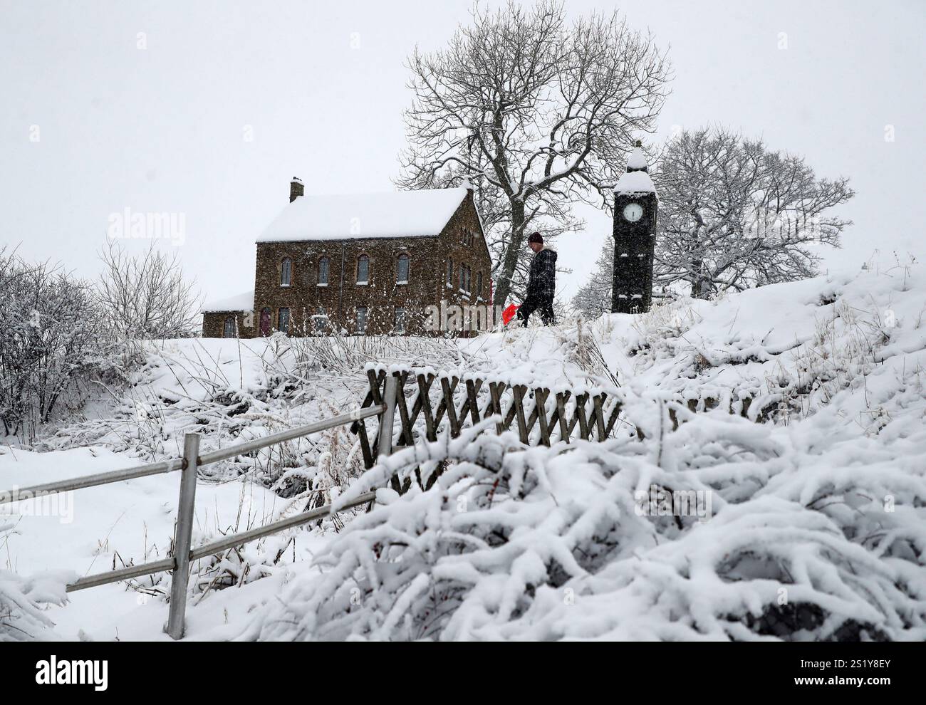 Lowson Robinson is pictured in the heavy snow with his scaled miniature ...
