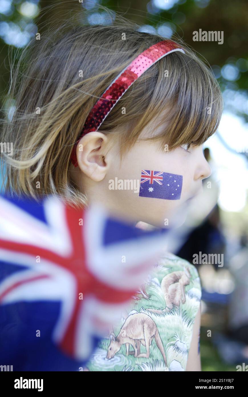 Young caucasian girl celebrating Australia Day with the Australian flag ...