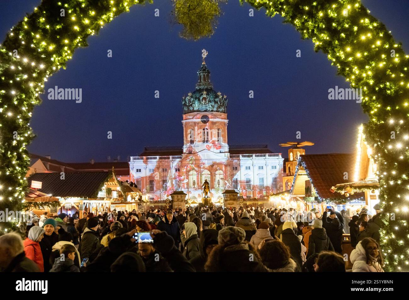 People visit the Christmas Market by Charlottenburg Castle in Berlin ...