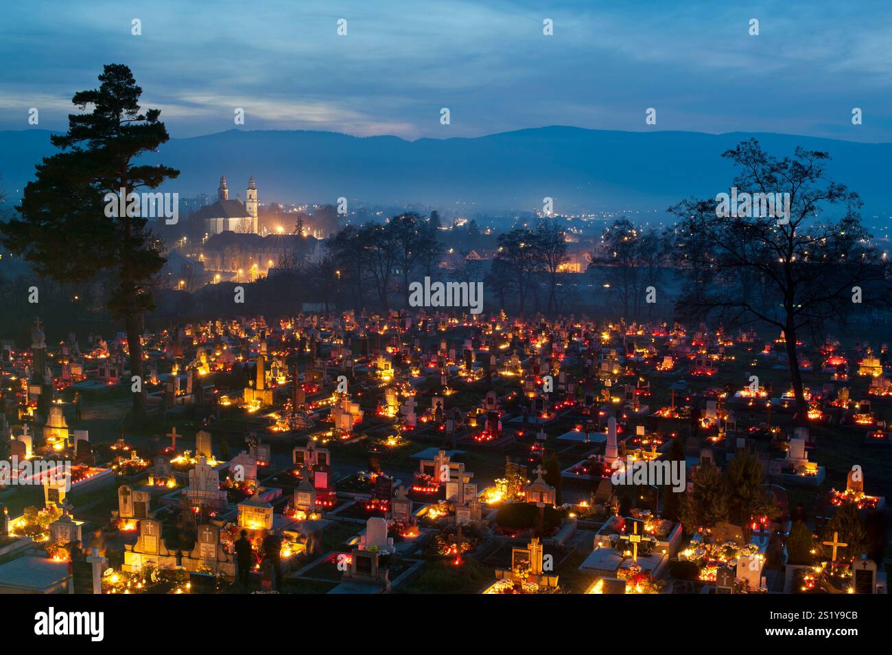 Night cemetery on All Saints' Day in Romania, Transylvania. Grave ...