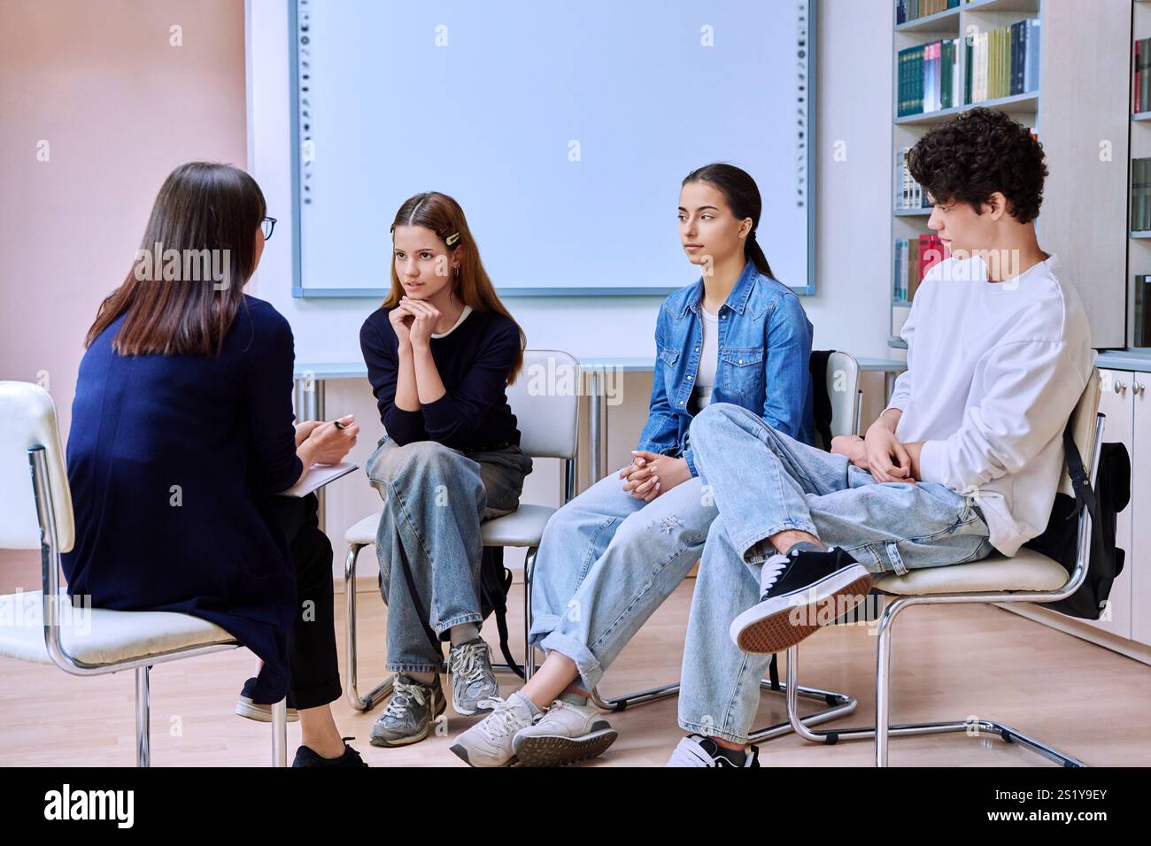 Group mental therapy, teenagers students talking with female psychologist, school counselor ...