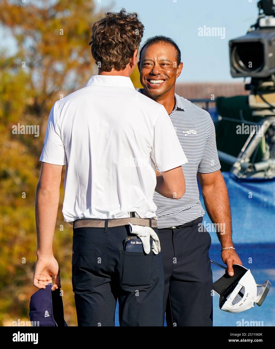 December 21, 2024, Orlando, Florida, USA: Tiger Woods (R) shakes hands ...