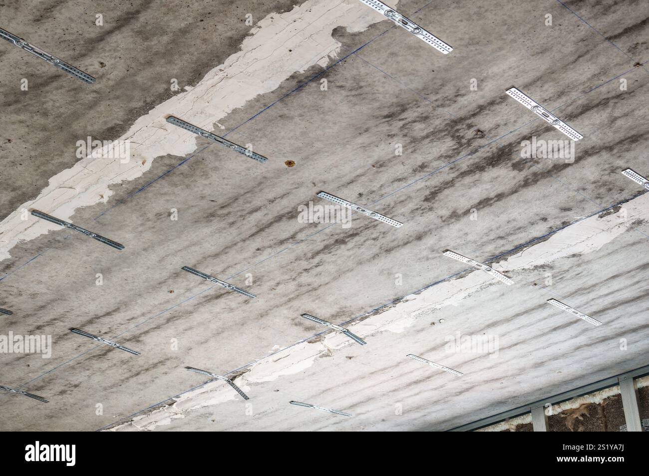 Mounted on the ceiling U-shaped fasteners for plasterboard ceiling ...