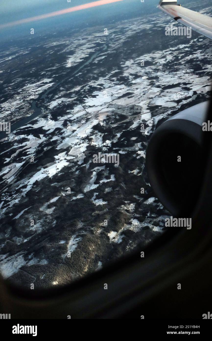 view over a snow covered landscape from a plane window Stock Photo - Alamy