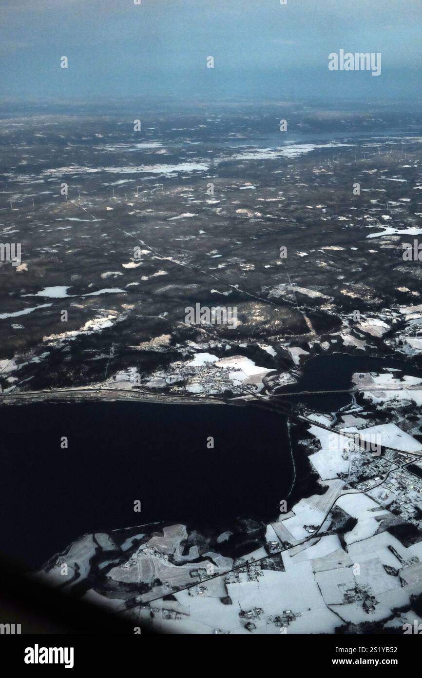 view over a snow covered landscape from a plane window Stock Photo - Alamy