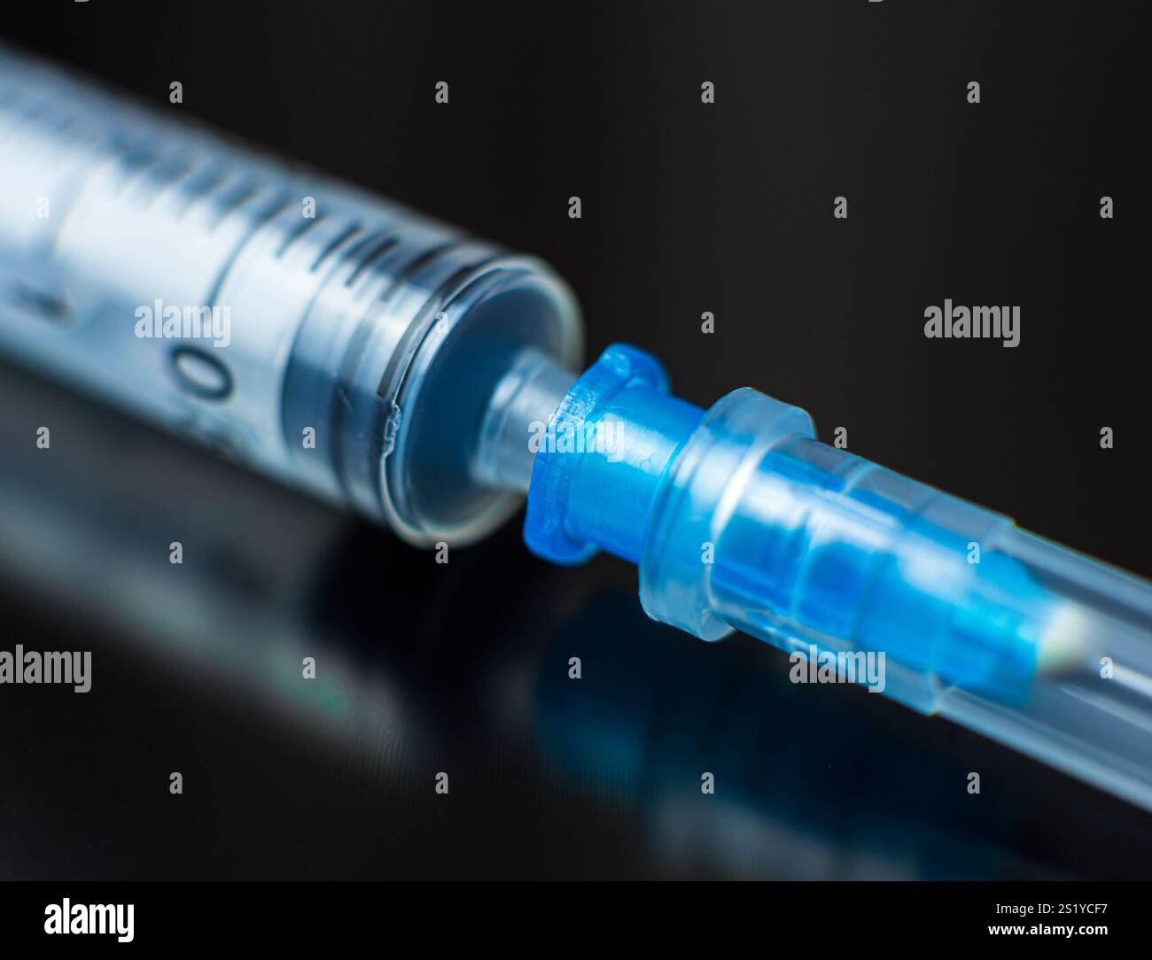 empty syringe positioned on a dark surface. High quality photo Stock ...
