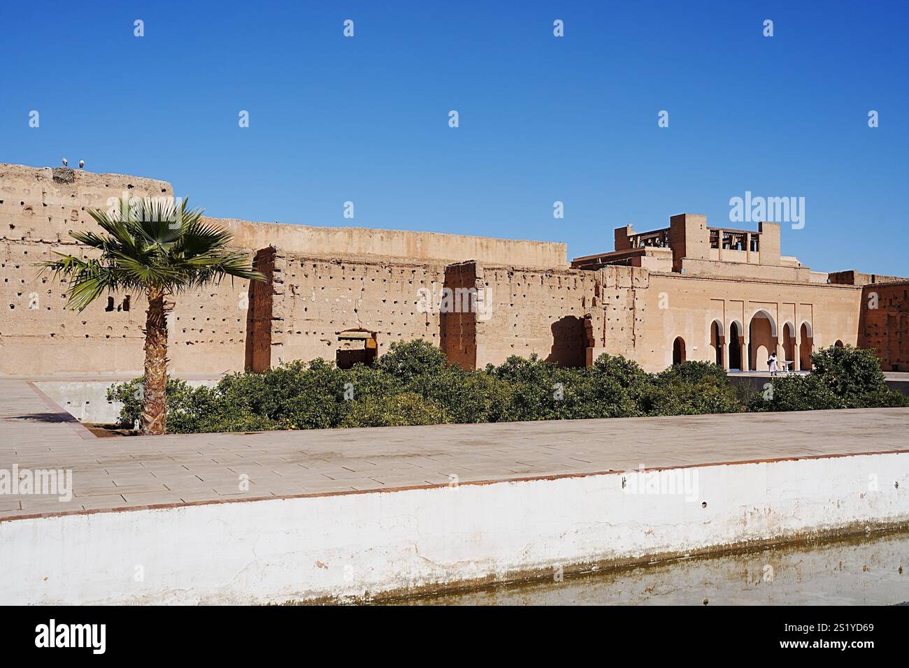 View of El Badi palace reflected in water in African MARRAKESH city in ...
