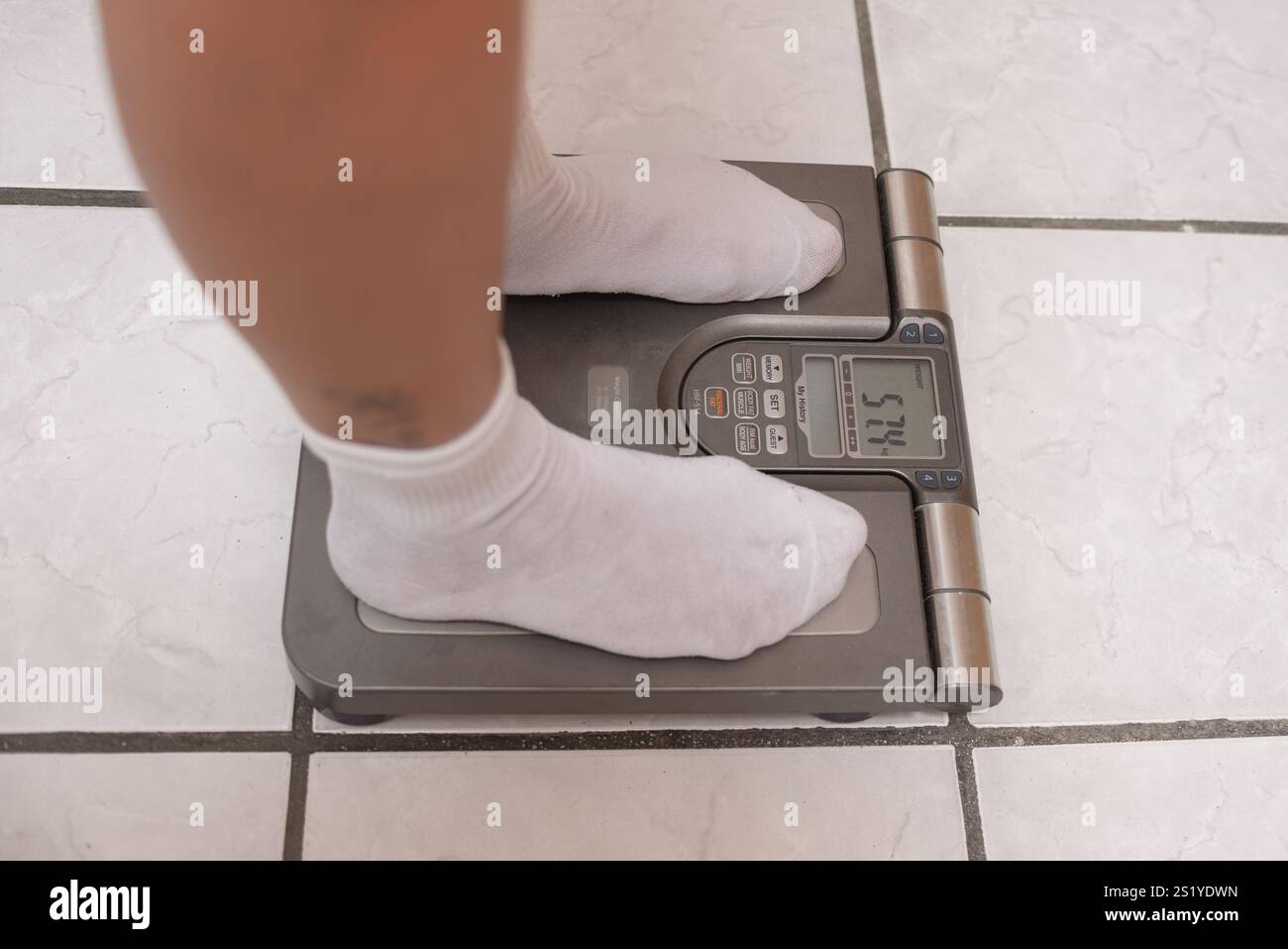 Female feet on a weighing scale. Body weight control concept Stock ...