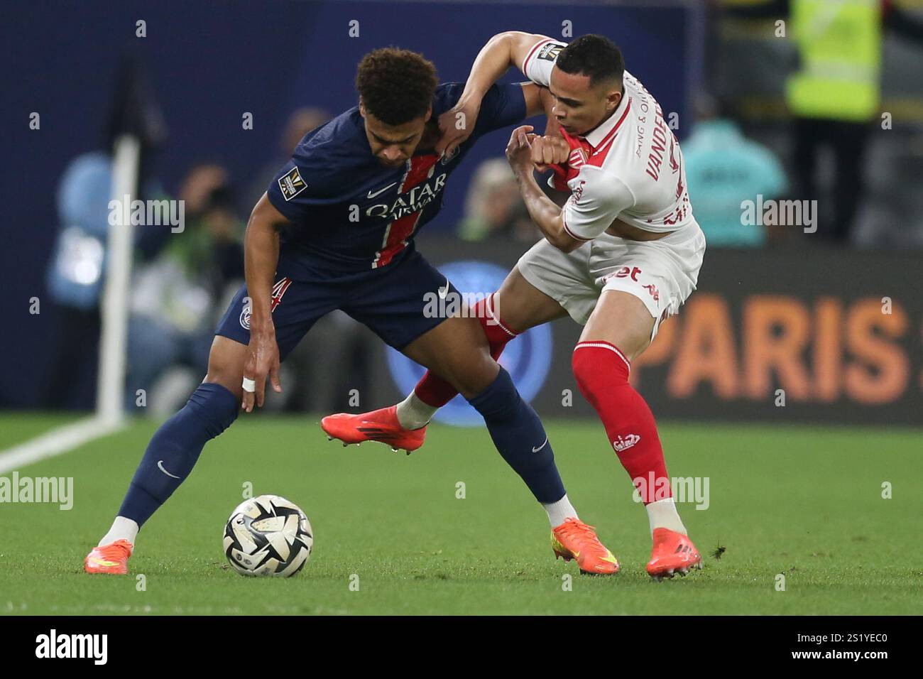 PSG's Desire Doue, left, and Monaco's Vanderson fight for the ball ...