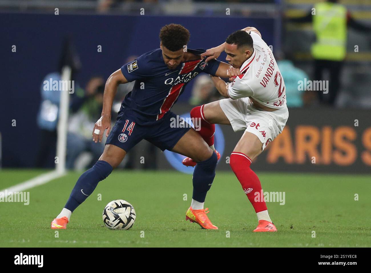 PSG's Desire Doue, left, and Monaco's Vanderson fight for the ball ...
