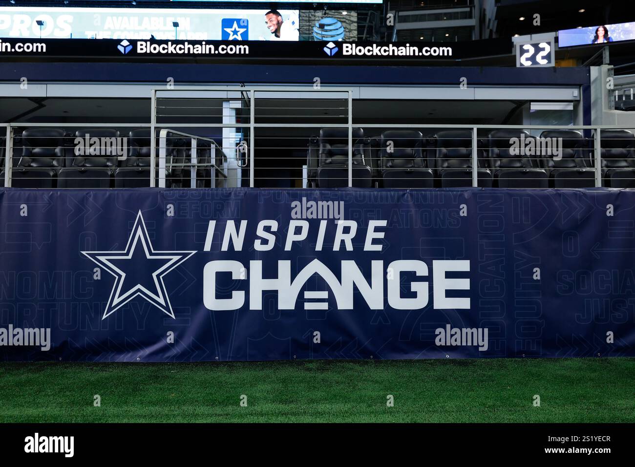 A wall sign / banner at AT&T Stadium shows the NFL's "Inspire Change ...