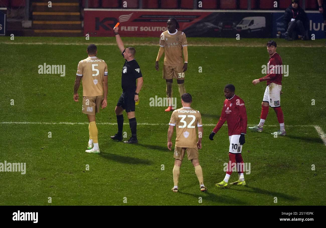 Referee Scott Jackson shows Bromley's Kamarl Grant (not pictured) a red ...