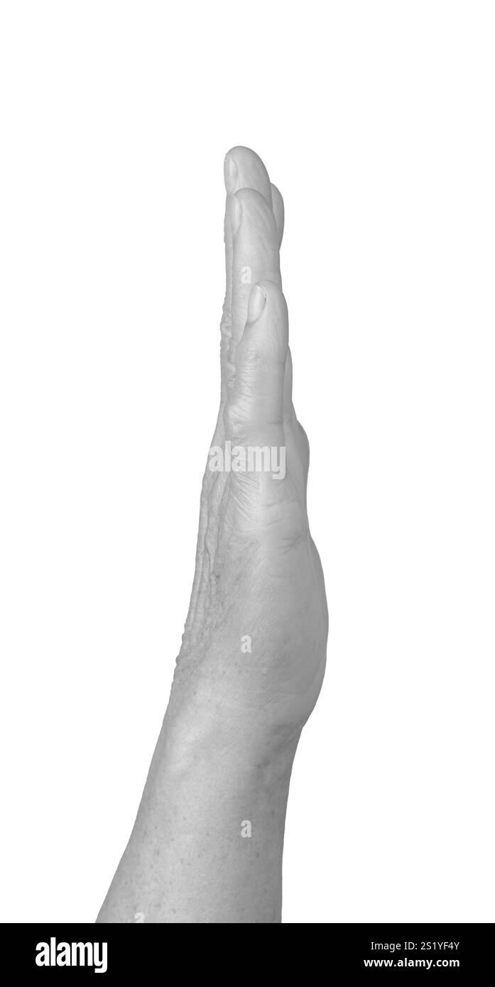 Salute hand gesture. Senior woman s wrinkled hand held upright in a ...