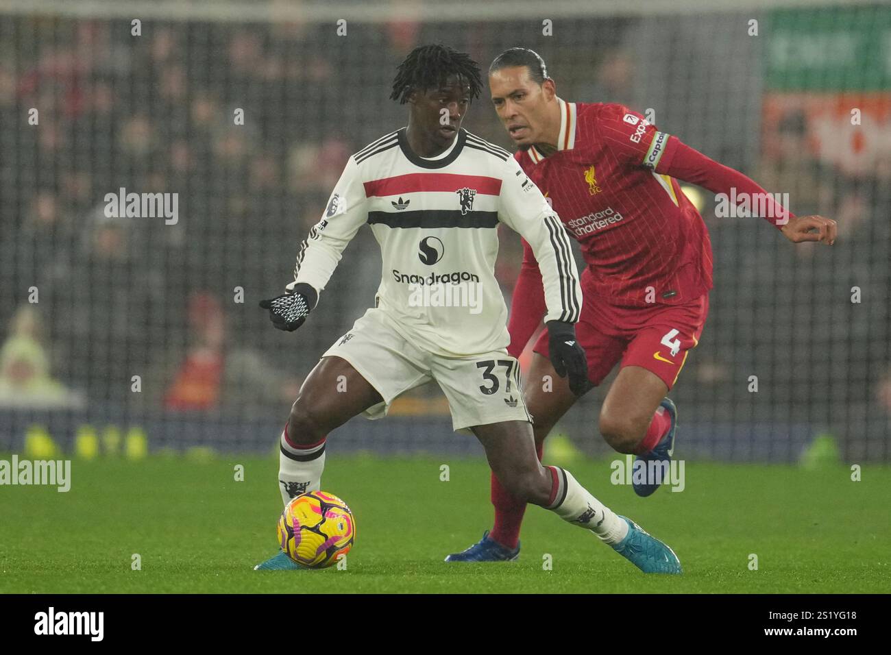 Manchester United's Kobbie Mainoo, left, and Liverpool's Virgil van ...